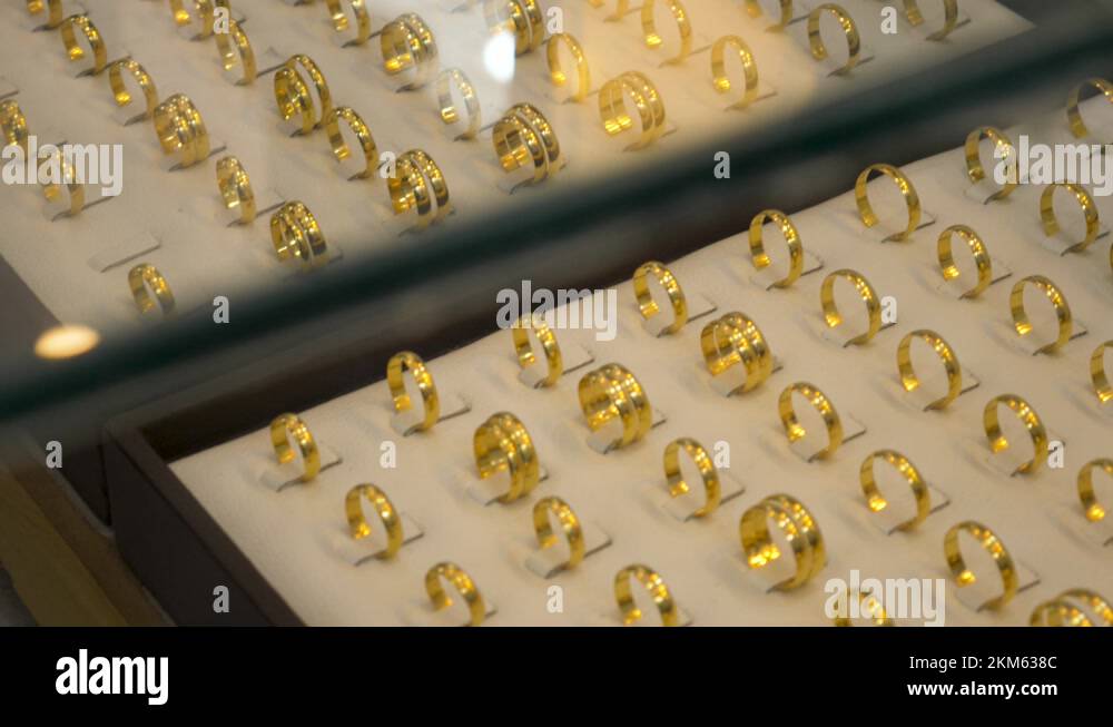 Gold shop display table full of golden rings with many sizes and shapes ...