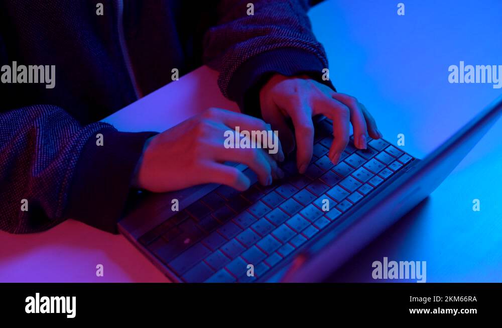 A young woman is typing on a laptop keyboard. Hands close up. Hacker makes a Stock Video Footage ...