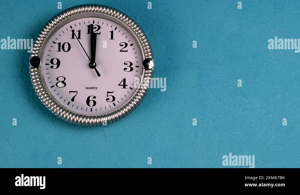 Quartz wall clock with second hand runs clockwise. The clock shows ...