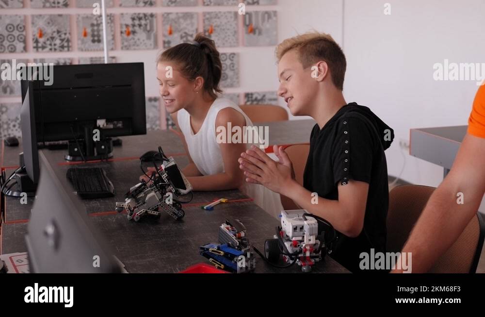 Kids building robot constructor from the plastics details at robotics ...