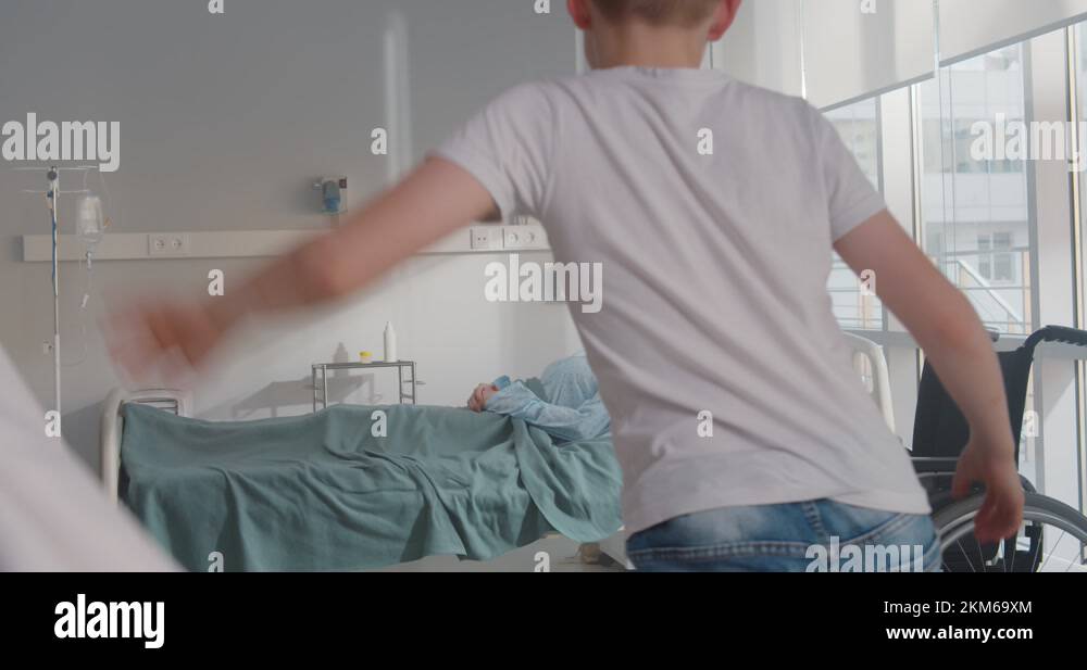 Preteen boy visiting and hugging sick mother in hospital Stock Video ...