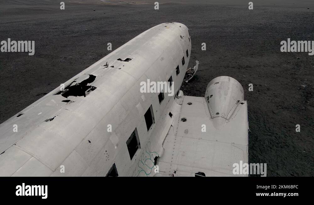 Aerial forward over destroyed fuselage of airplane relict Douglas ...