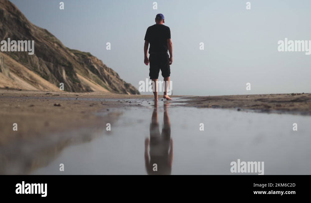 Man walking through beach Stock Videos & Footage - HD and 4K Video Clips - Alamy