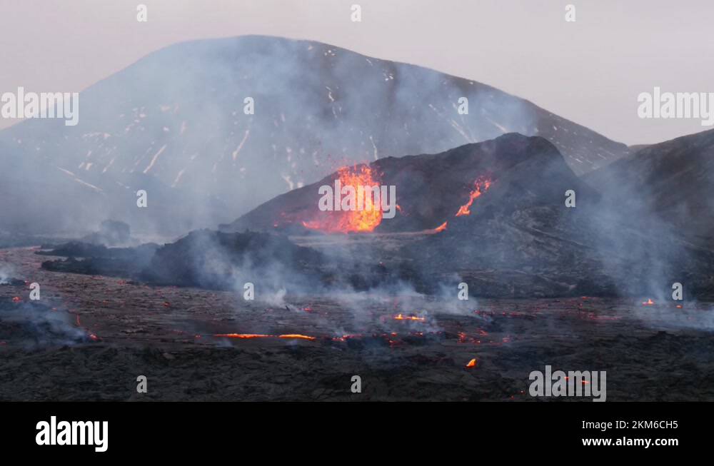 Volcanic eruption with spraying lava near Fagradalsfjall, Iceland with ...