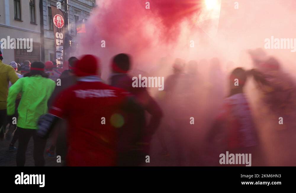 Large crowd of runners competing in the Spartan Race obstacle course ...