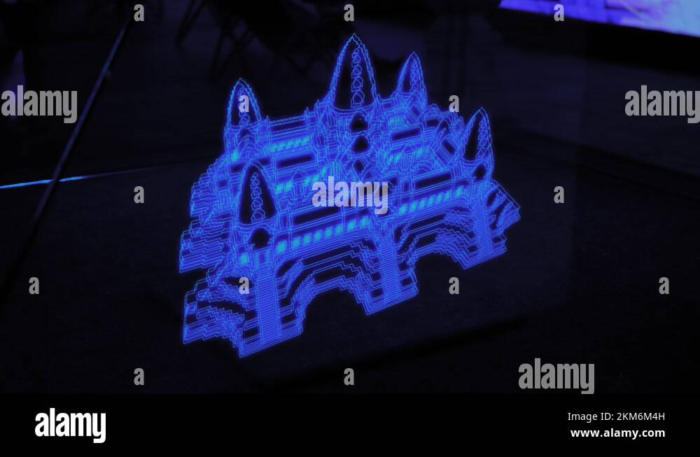 Rotating blue 3d hologram of ancient temple Angkor Wat in dark room ...
