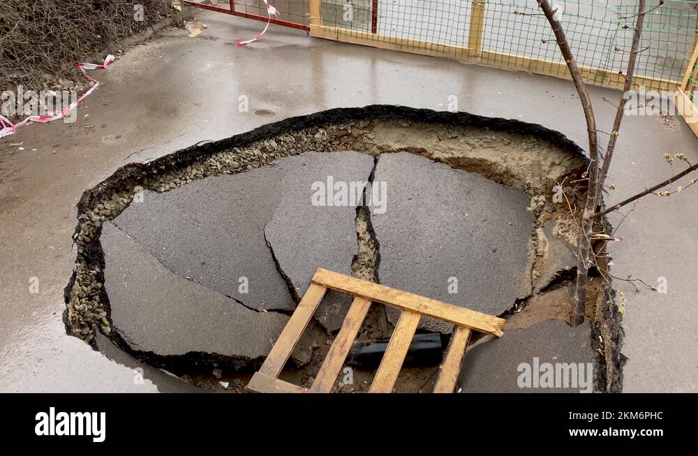 Hole in a pavement pavement sidewalk sidewalks Stock Videos & Footage ...