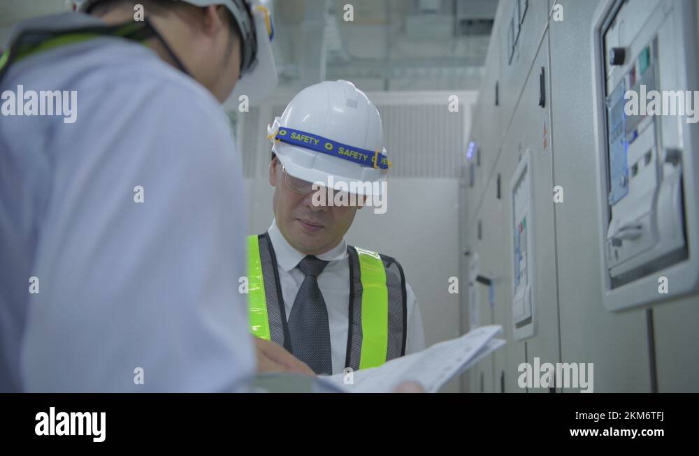 Engineer concept of 4k Resolution. The employee is checking the ...