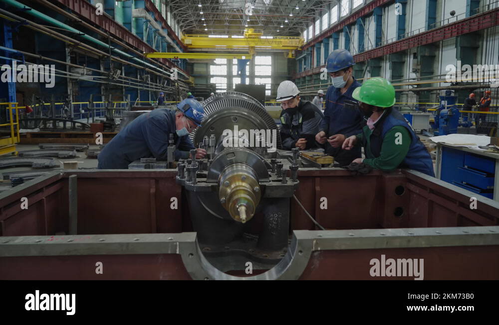 Group of power engineers are designing a new type of steam turbine at Factory Stock Video ...