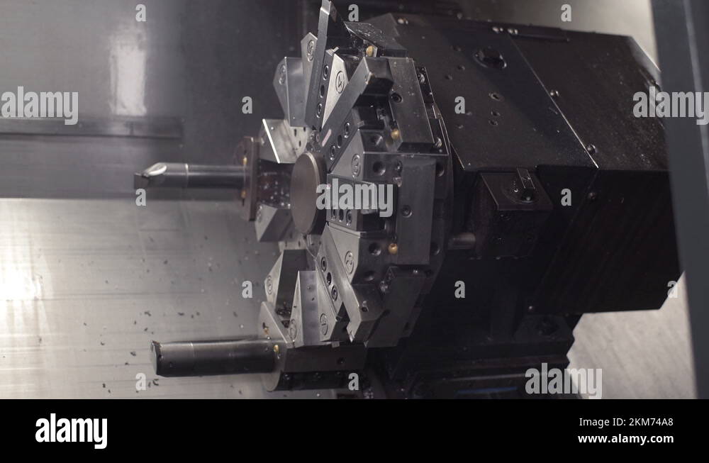 Turning lathe in action. Facing operation of metal blank on turning ...