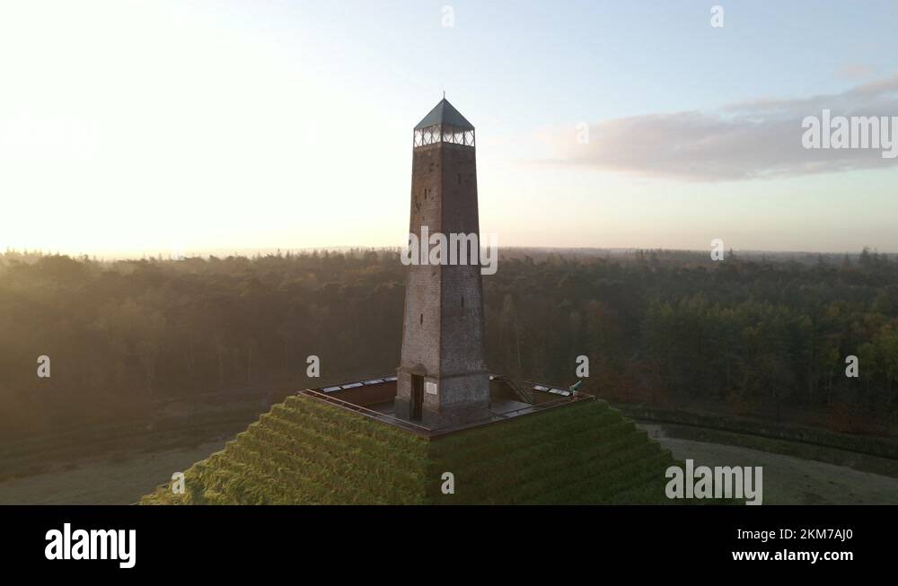 Circling around brick obelisk on top of earth Pyramid during sunrise ...