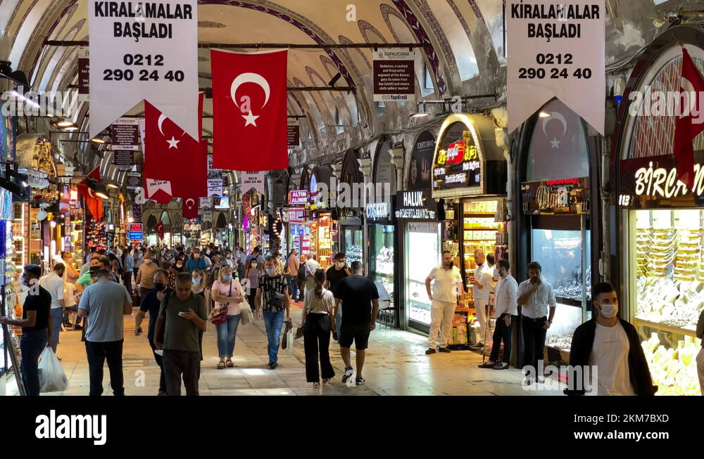 Static wide clip of busy main indoor thoroughfare of Grand Bazaar in ...