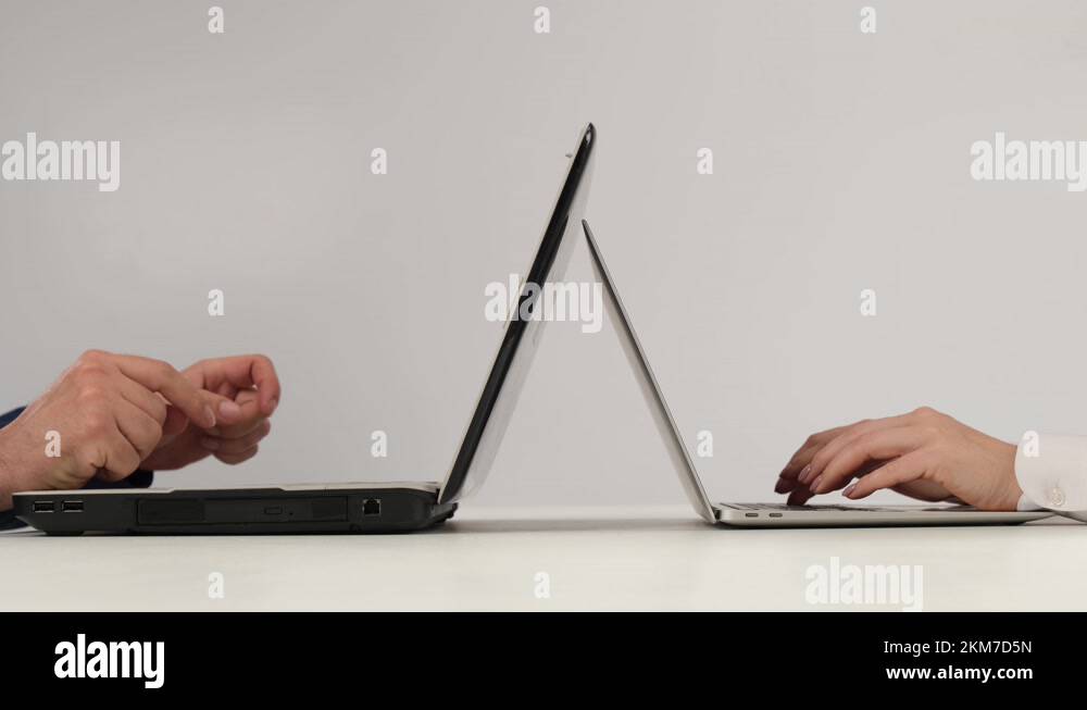 Man and woman work on laptops on a white background. Comparison of fast ...