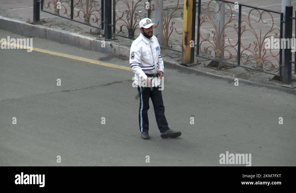Iranian male police officer in uniform organizing traffic Stock Video ...