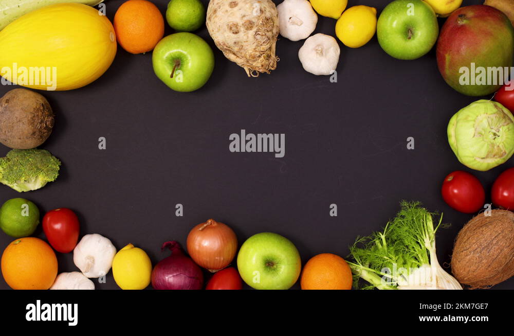 Vibrant frame made of moving fresh fruits and vegetables. Stop motion ...
