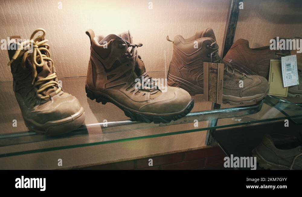 military store with different soldier and tactical boots and footwear ...