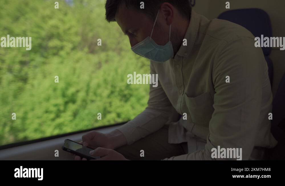 New norm of public transport, person travels on train sits at safe ...