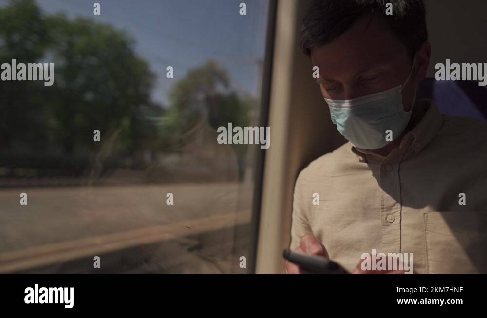 New norm of public transport, person travels on train sits at safe ...