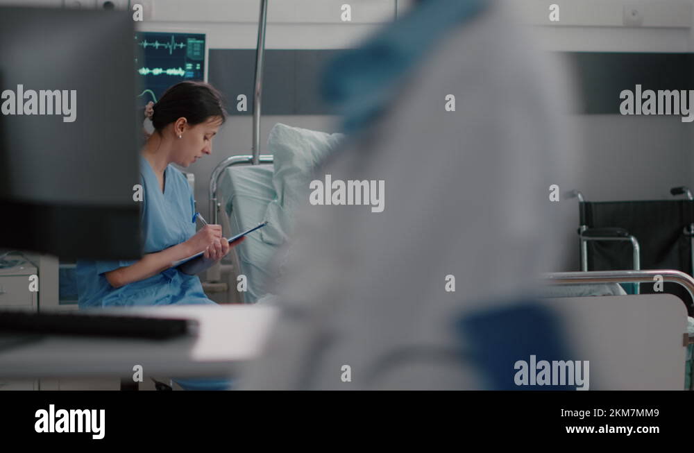 Sick man sitting in bed with oxygen tube explaining sickness symptom to ...