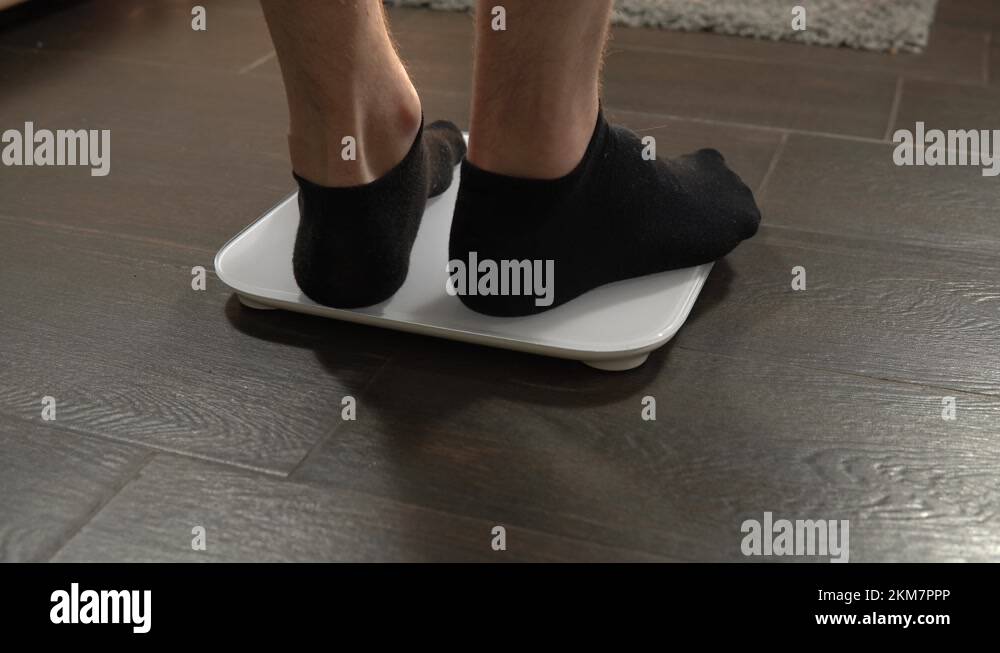 Man weighing scales Stock Videos & Footage - HD and 4K Video Clips - Alamy