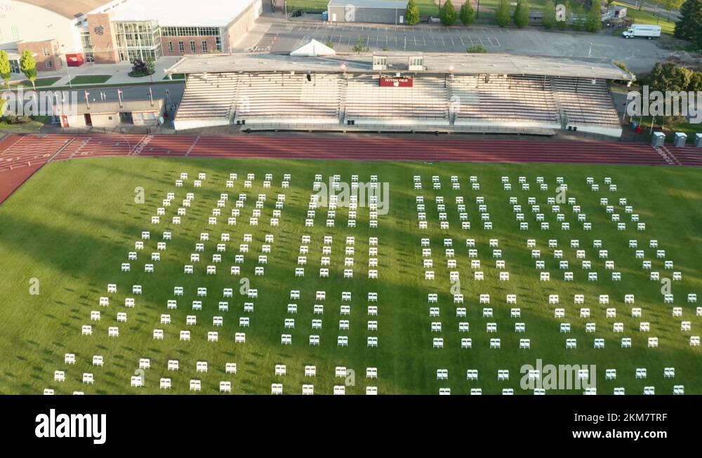 Rows Of An Empty Chair On A Sports Field For Commencement Ceremony Of ...