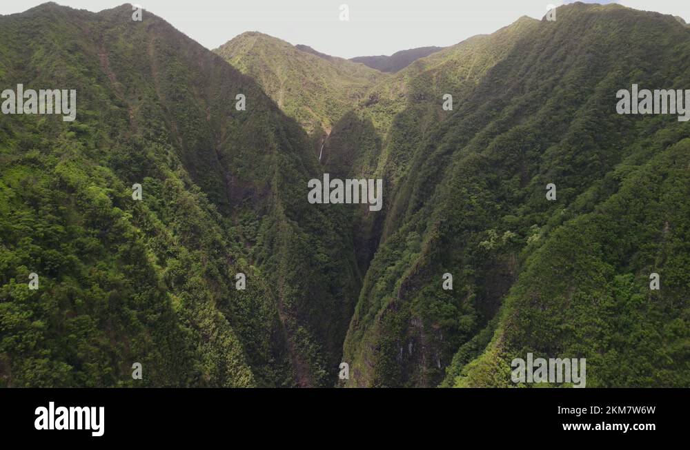 Creeping into the narrow valley of Sacred Falls Stock Video Footage - Alamy