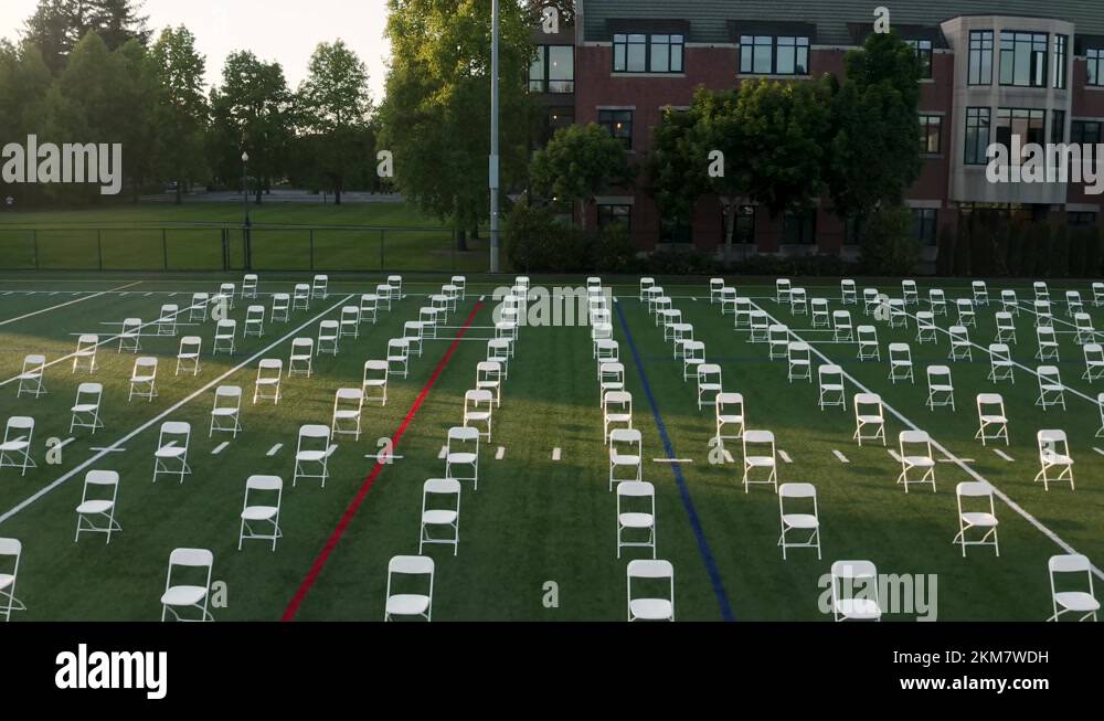Rows Of Vacant Chairs Arrange On An Open Field For Graduation Ceremony ...