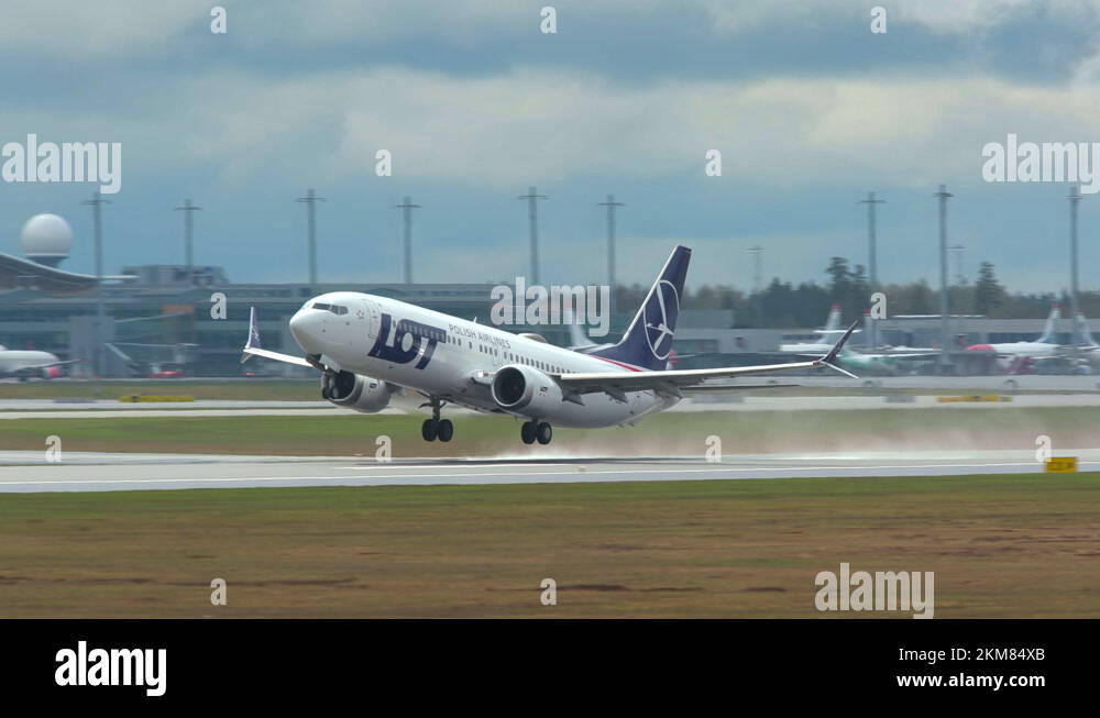 airplane boeing 737 max 8 lot polish airlines take off passing tower ...