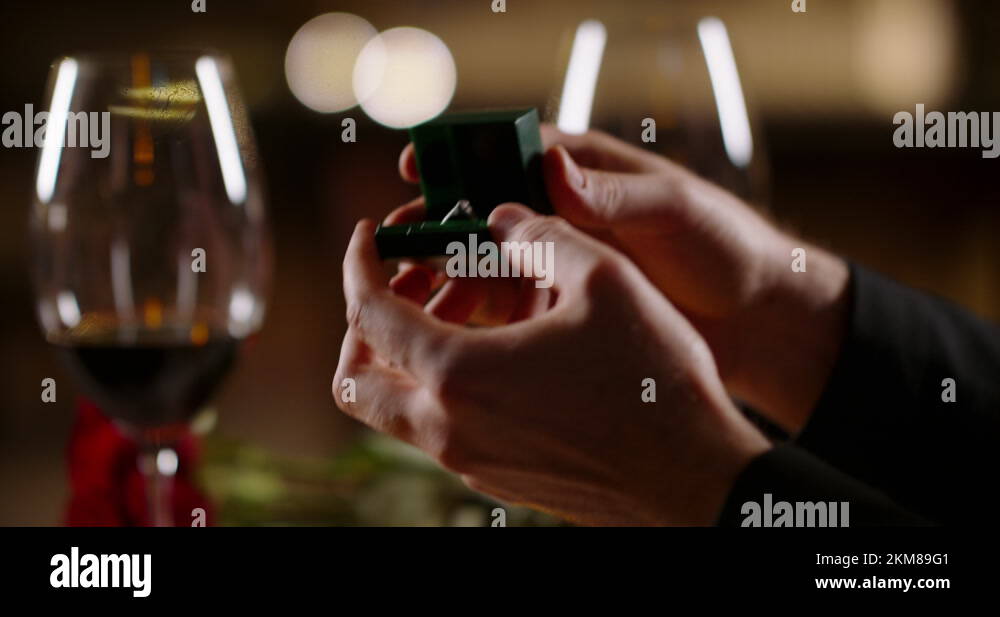 Man takes out engagement ring out and makes a proposal during a date in ...