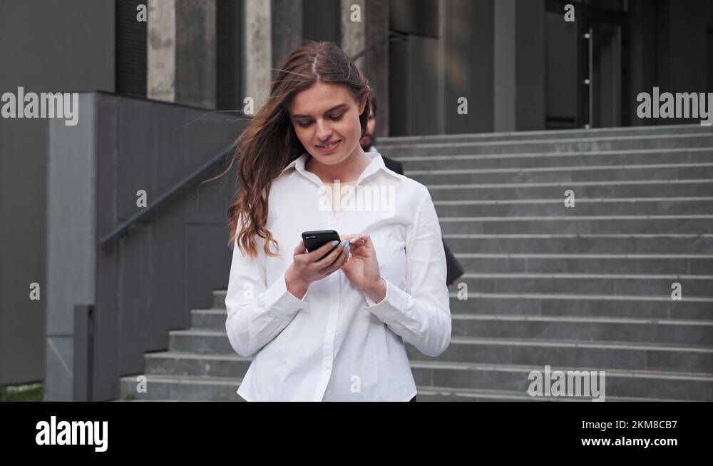 Beautiful women holding smartphone tapping scrolling social network ...