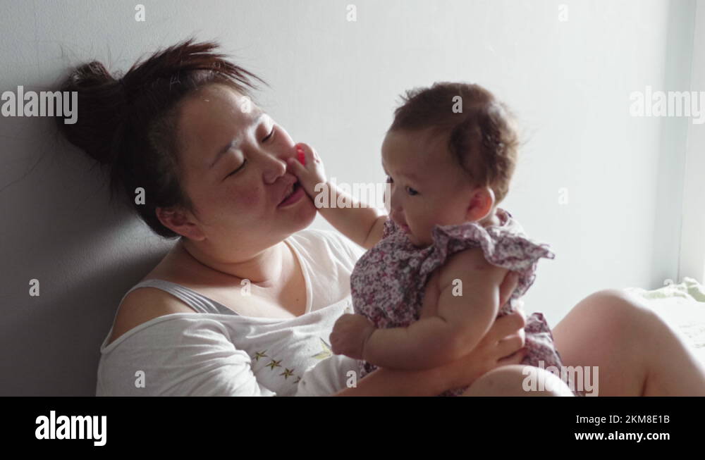 Korean mother showing unconditional love to her 10month old daughter as ...