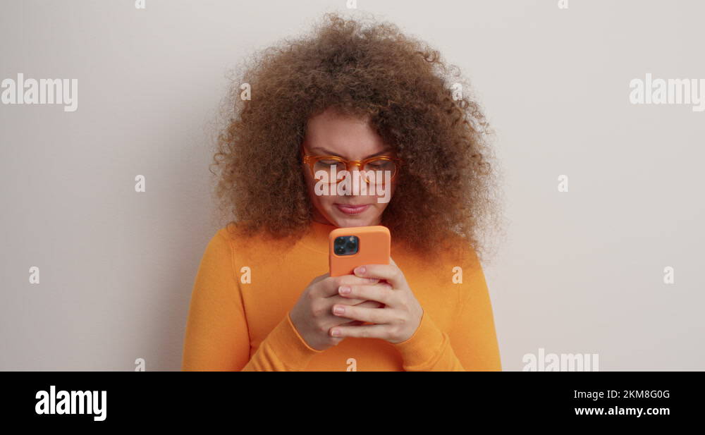 Angry irritated woman types messages very quickly sorts out ...