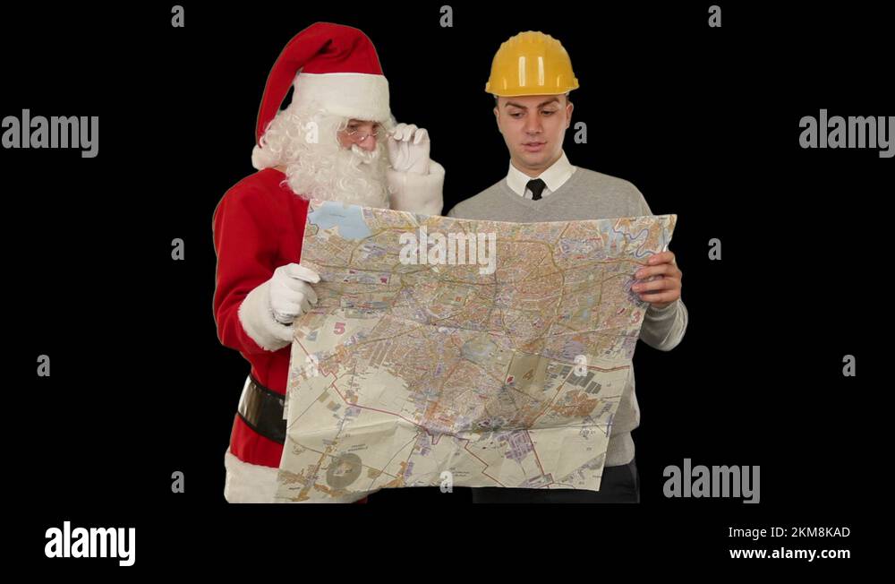 Santa Claus with a Young Architect reading a map, against black Stock ...