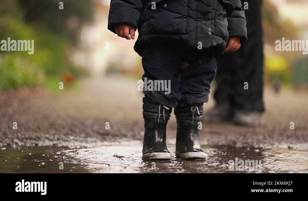 Child playing in puddle spring boots Stock Videos & Footage - HD and 4K ...
