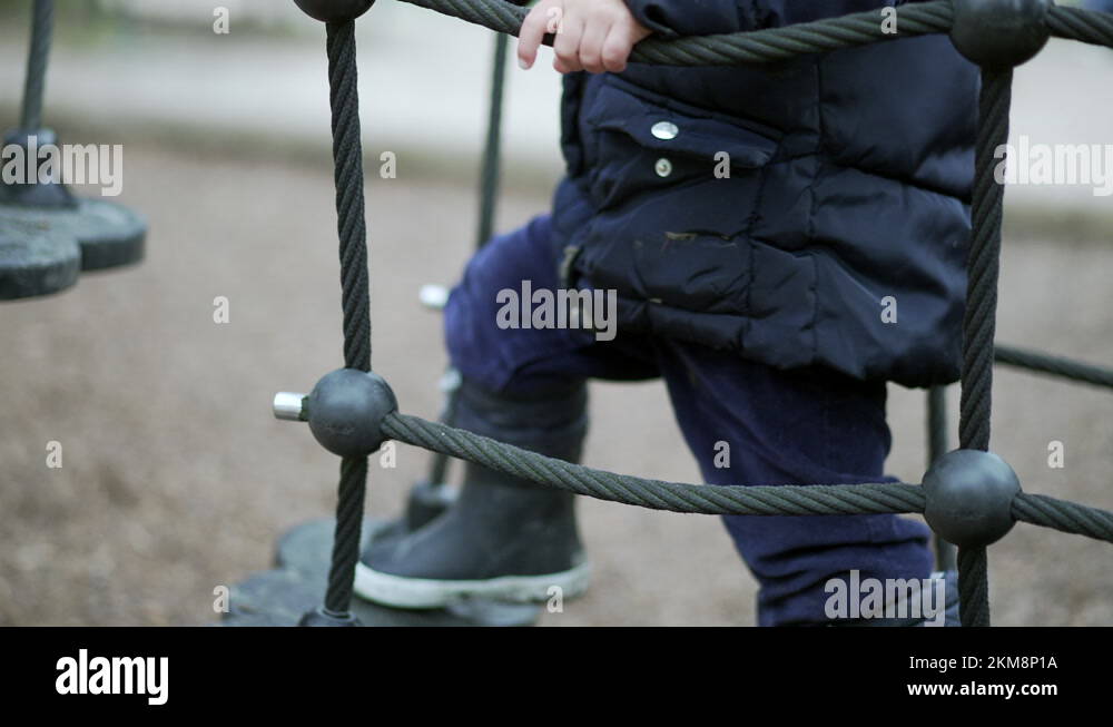 Toddler child learning at playground park taking risks. Childhood ...