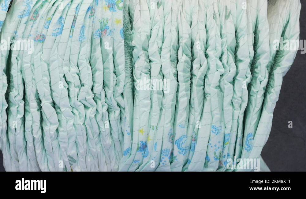 stack of baby diaper on black background Stock Video Footage - Alamy