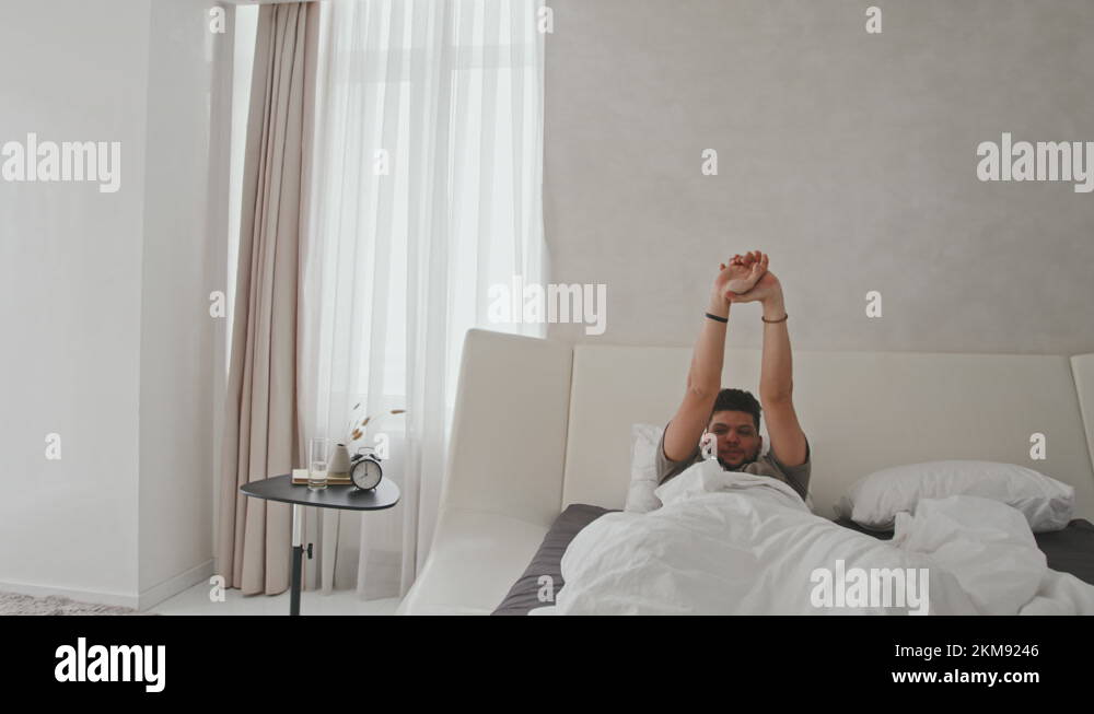 Handsome man waking up stretching Stock Videos & Footage - HD and 4K ...