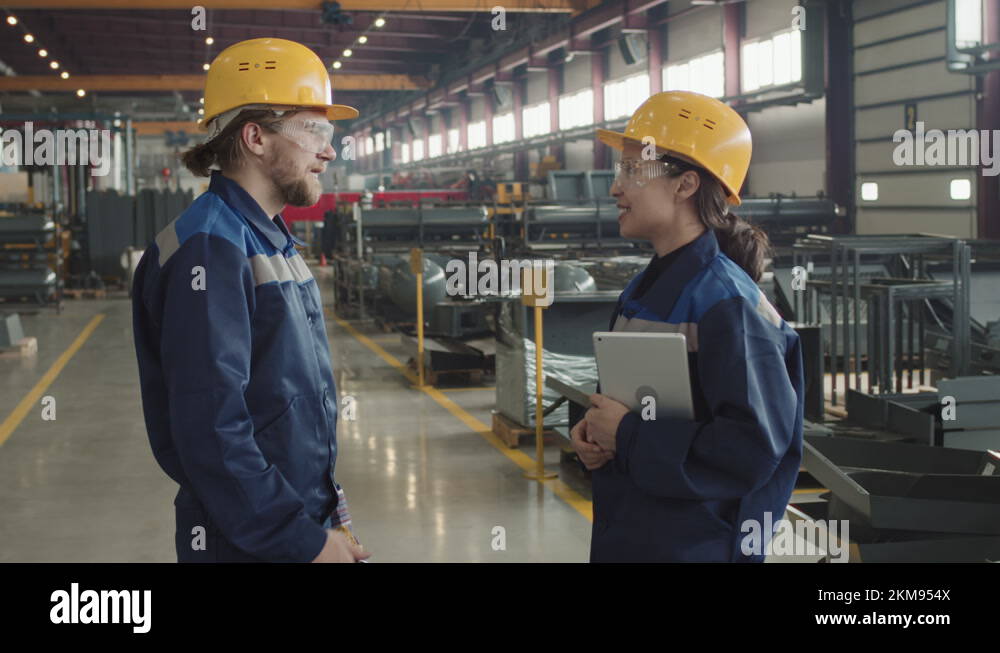 Male And Female Factory Workers Smiling And Shaking Hands Stock Video ...