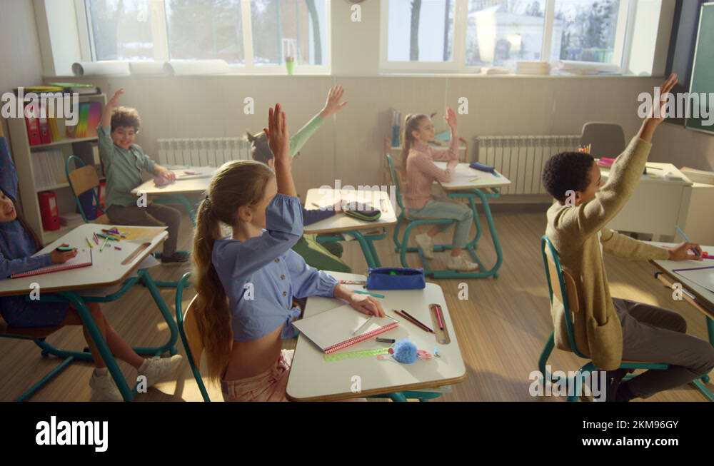 Students studying in school class. Cheerful kids having lesson in ...