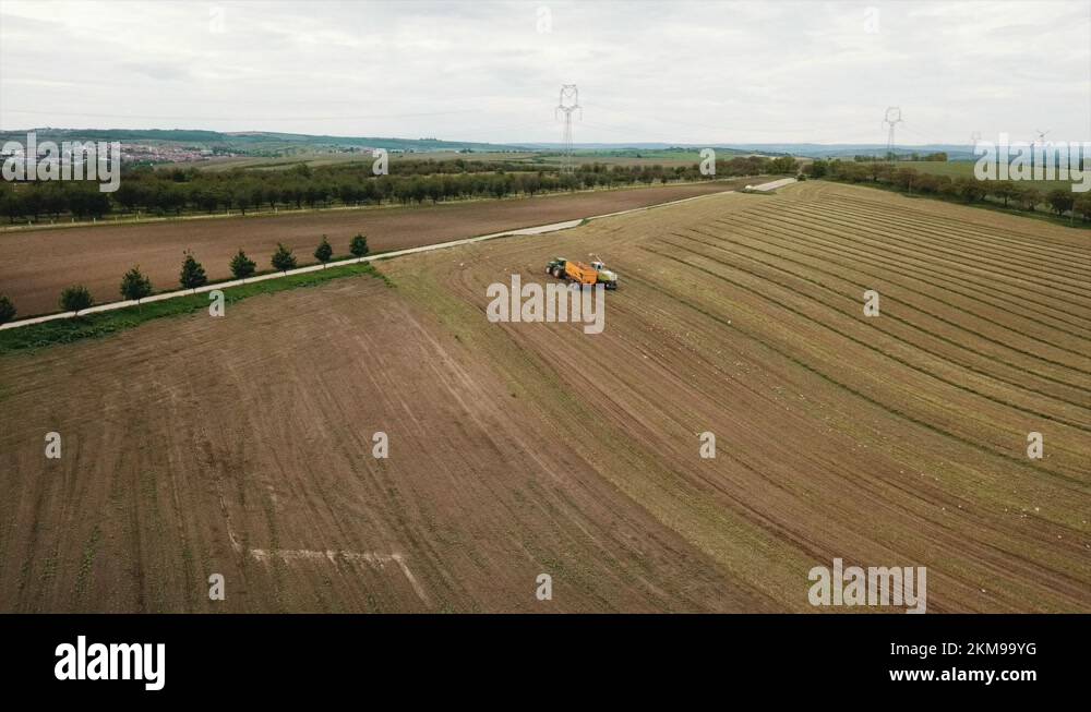 Bird's Eye View Of The Farm Trucks Park At The Bare Field. aerial Stock ...