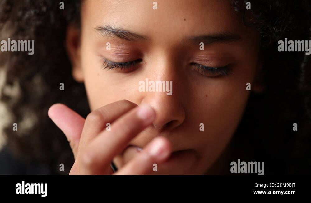 Child scratching face with hand. Girl touches face with finger Stock ...