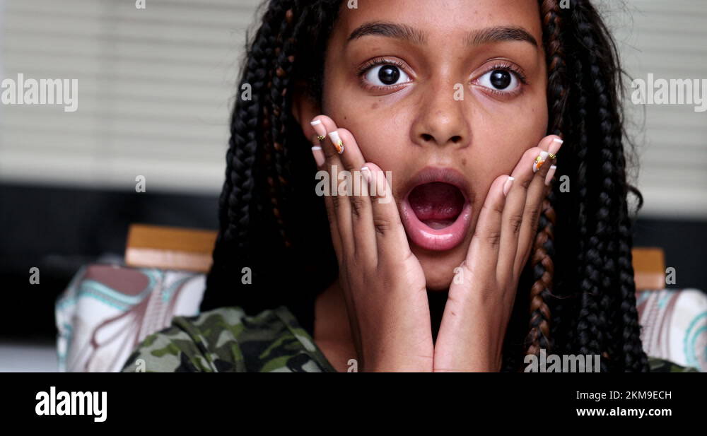 Preteen child shock surprise reaction. Girl amazement emotion Stock Video Footage - Alamy