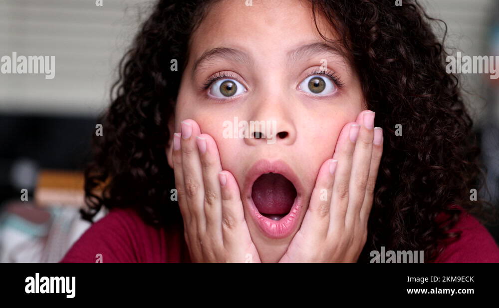 Preteen child shock surprise reaction. Girl amazement emotion Stock Video Footage - Alamy