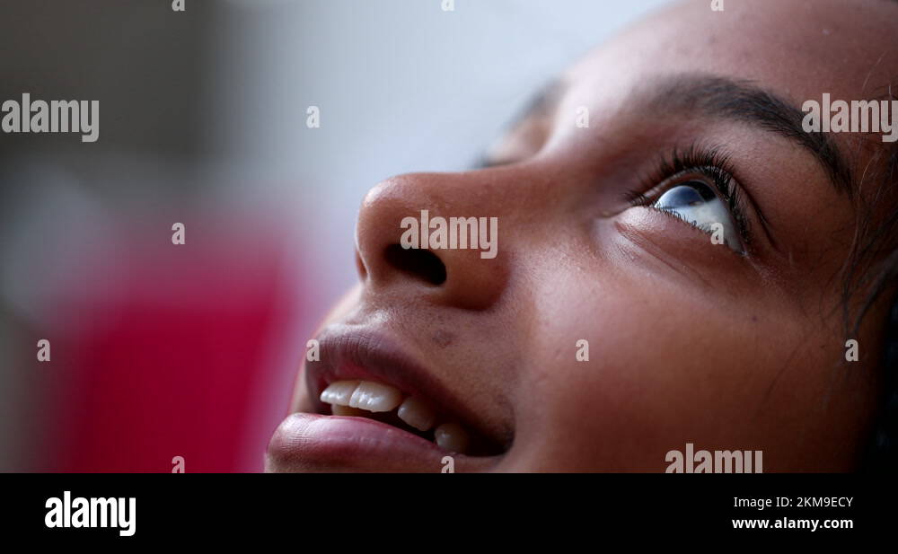 Preteen girl eyes looking up at sky smiling, Black African descent Stock Video Footage - Alamy