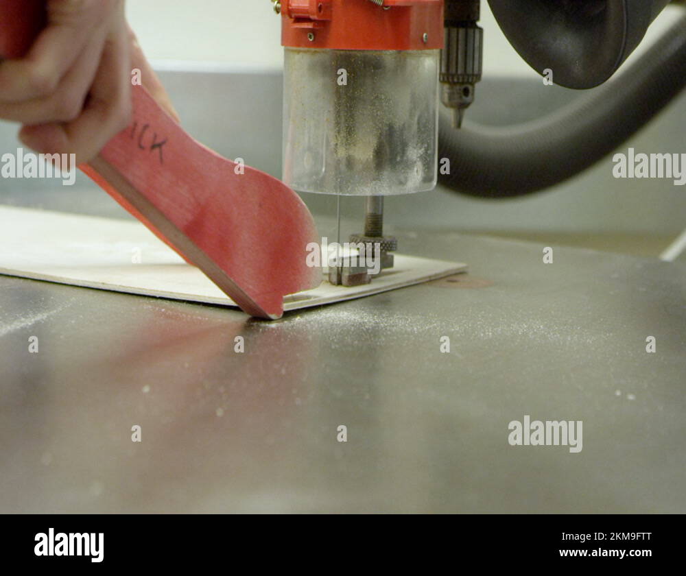 Carpenter using cutting out shapes on piece of wood, Nottingham ...