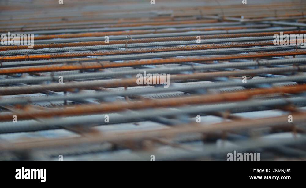 Footage of the rusty metal rods in rows at a construction site ...