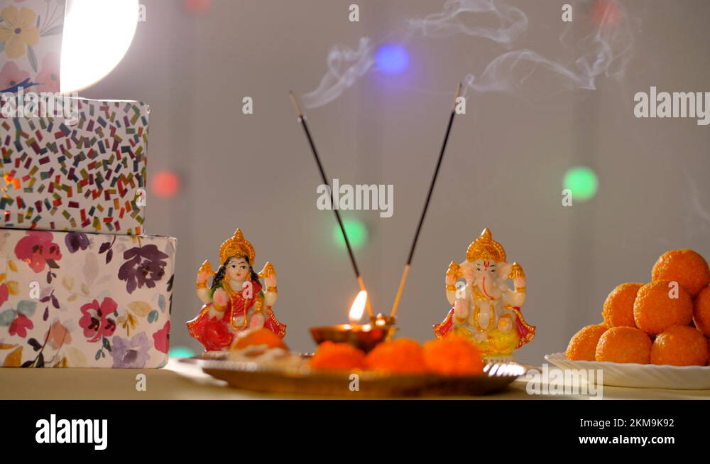 Beautiful prayer scene with Diya and incense sticks in front of Hindu ...