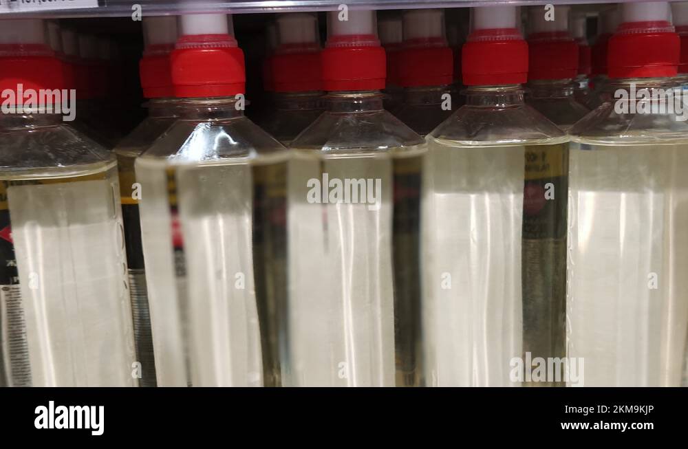 Chemical bottles in a package stand in rows together on shelves Stock ...