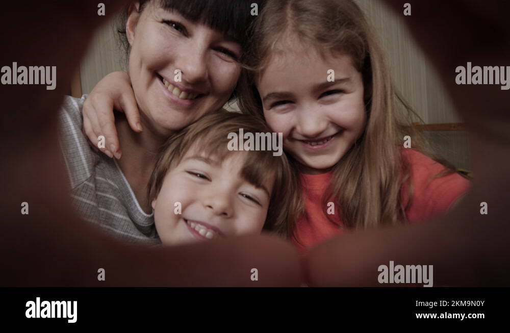 Mother and Kids Making Heart Shape From Hand at Home. Portrait Happy ...