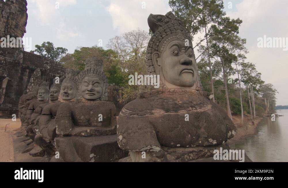 The many faces statue of Angkor Thom leading to the south gate. Dolly ...